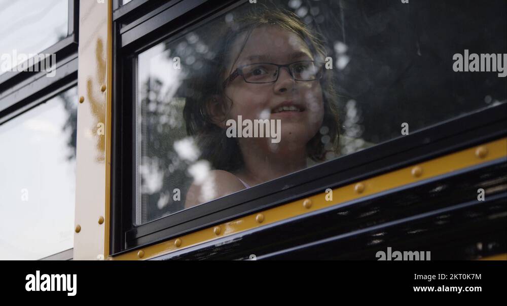Nerdy girl with goofy smile in a school bus window Stock Video Footage ...