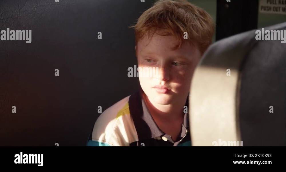 sad kid on school bus - young boy Stock Video Footage - Alamy