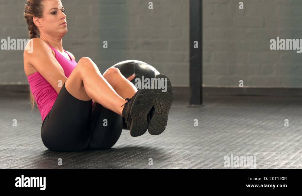 Fit people doing russian twist exercises Stock Video Footage - Alamy