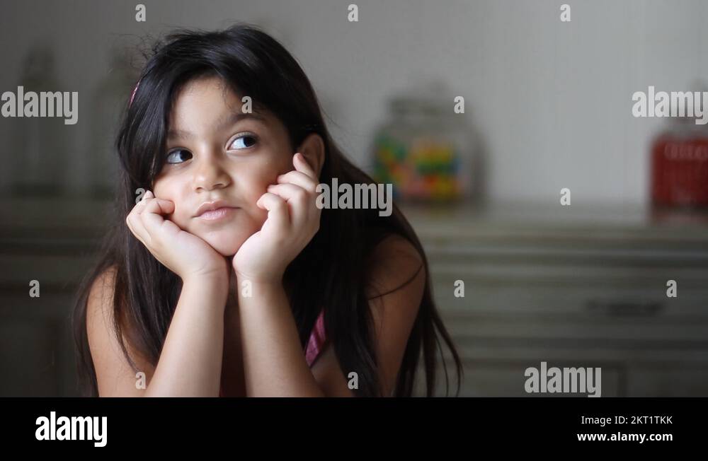 little girl gets emotional smile think Stock Video Footage - Alamy