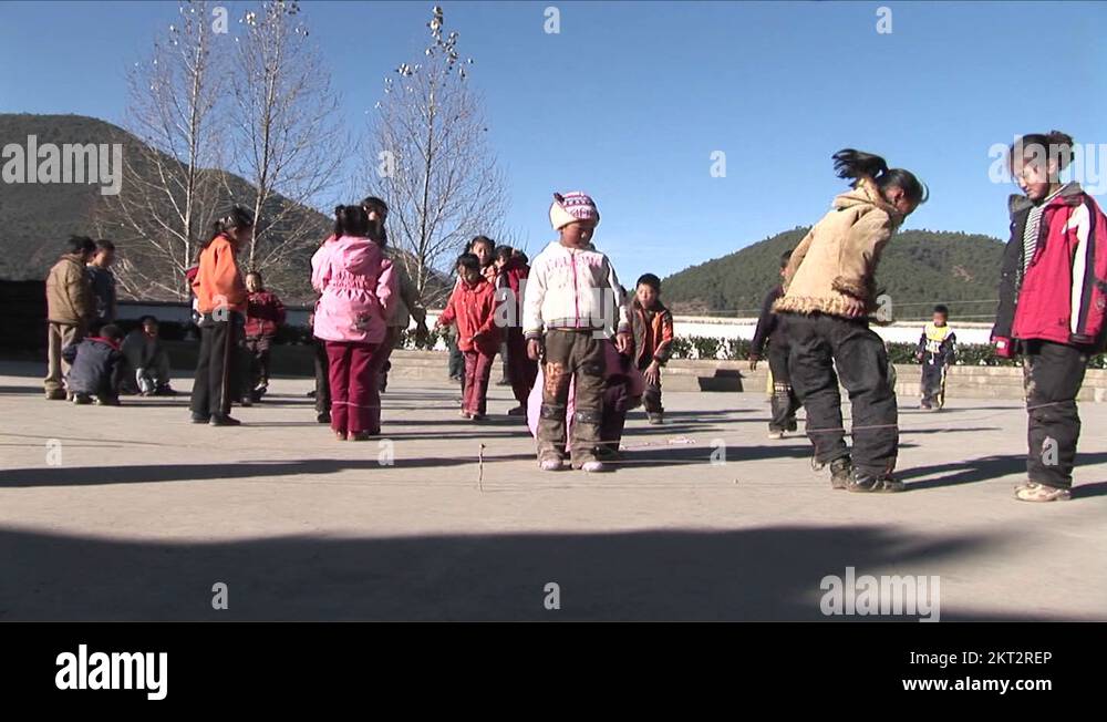 Chinese children play games in a schoolyard Stock Video Footage - Alamy