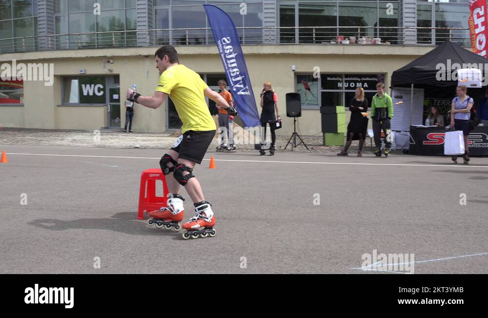 Roller skater team competition in relay-race relay with barriers. 4K ...