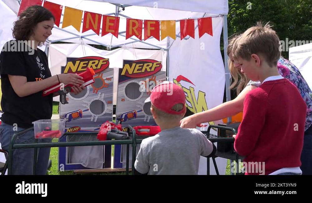 Boys play shoot with toy gun with plastic bullets at target. 4K Stock ...