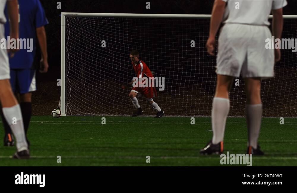 A goalkeeper kicks a soccer ball back into play Stock Video Footage - Alamy