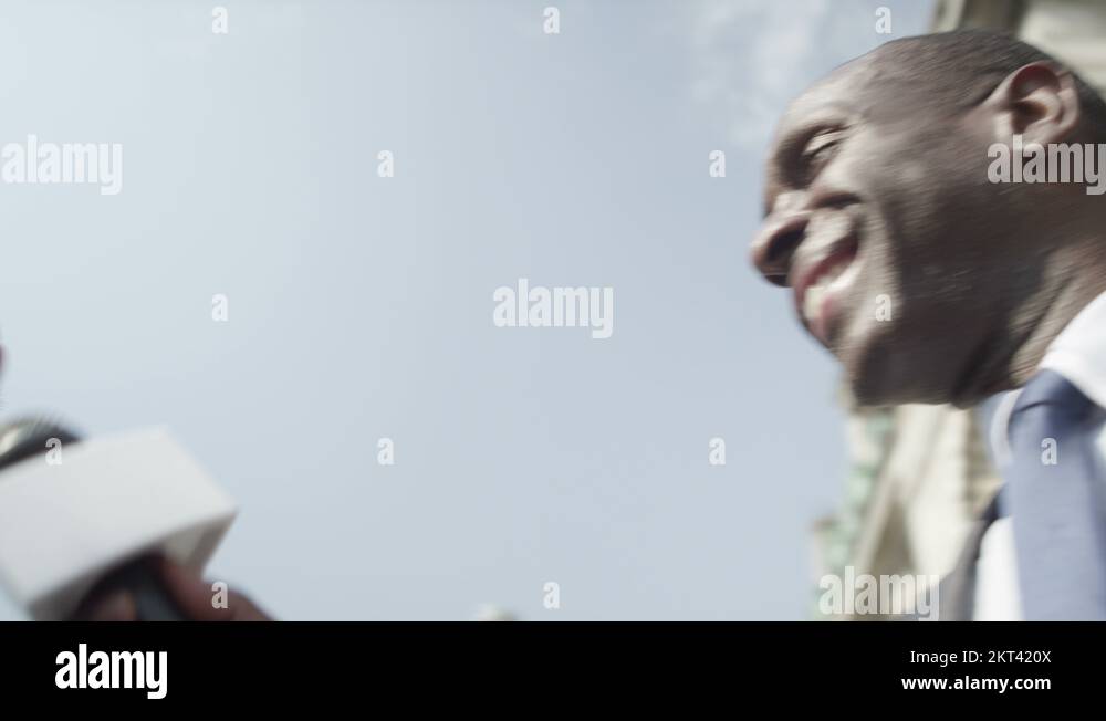 4k News reporter interviewing 2 people outdoors in the city of London ...