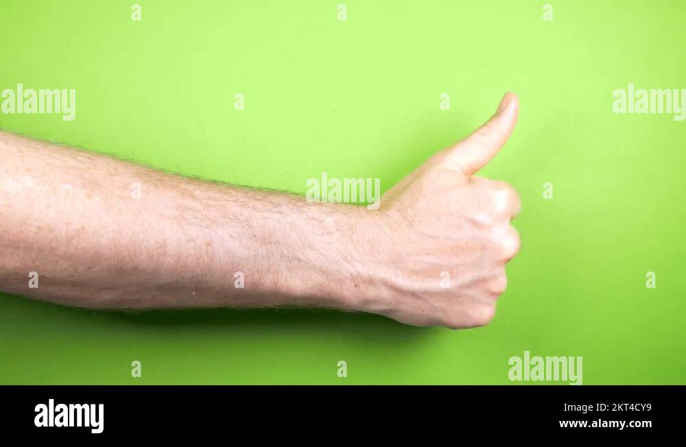 4k thumbs up hand green screen background gesture chroma key Stock Video Footage - Alamy