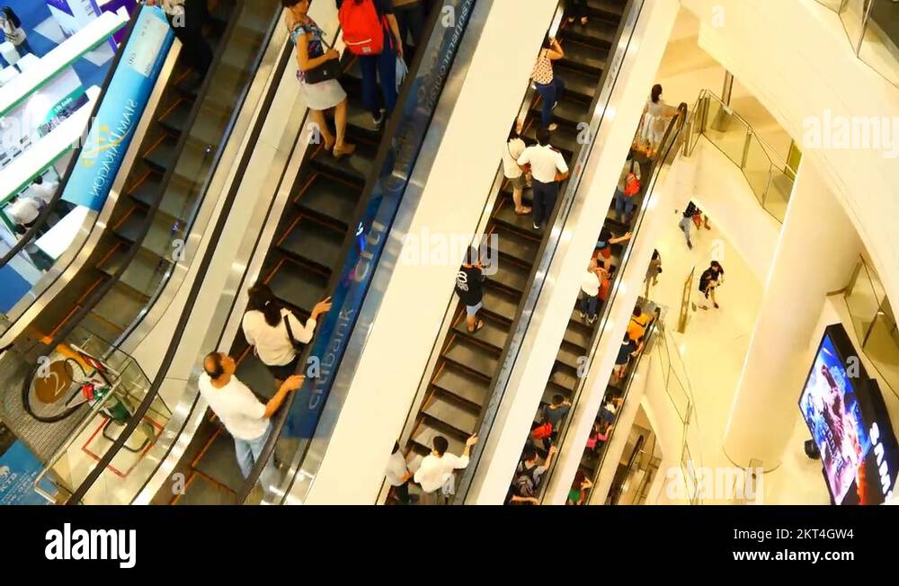 Escalator 4k shopping mall crowd of people buy shop center centre Stock Video Footage - Alamy