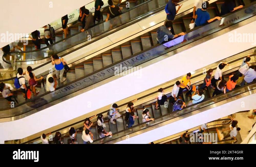 Escalator 4k shopping mall crowd of people buy shop center centre Stock Video Footage - Alamy