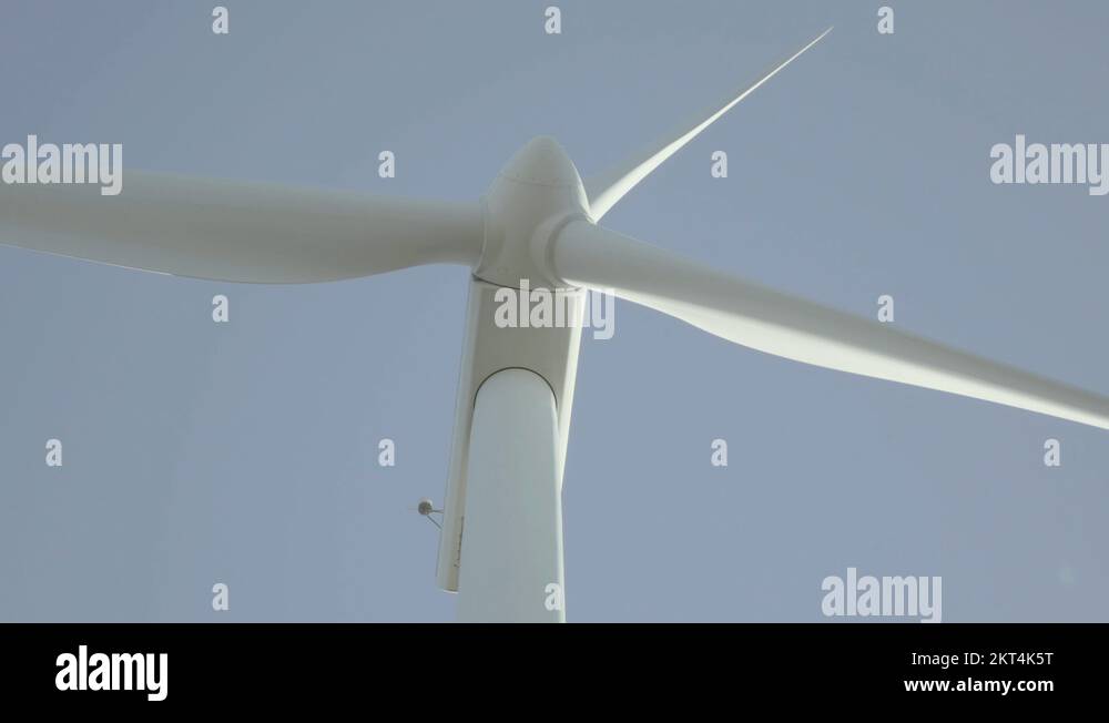 Wind mill turbines blades rotating generating power Extreme Close up ...