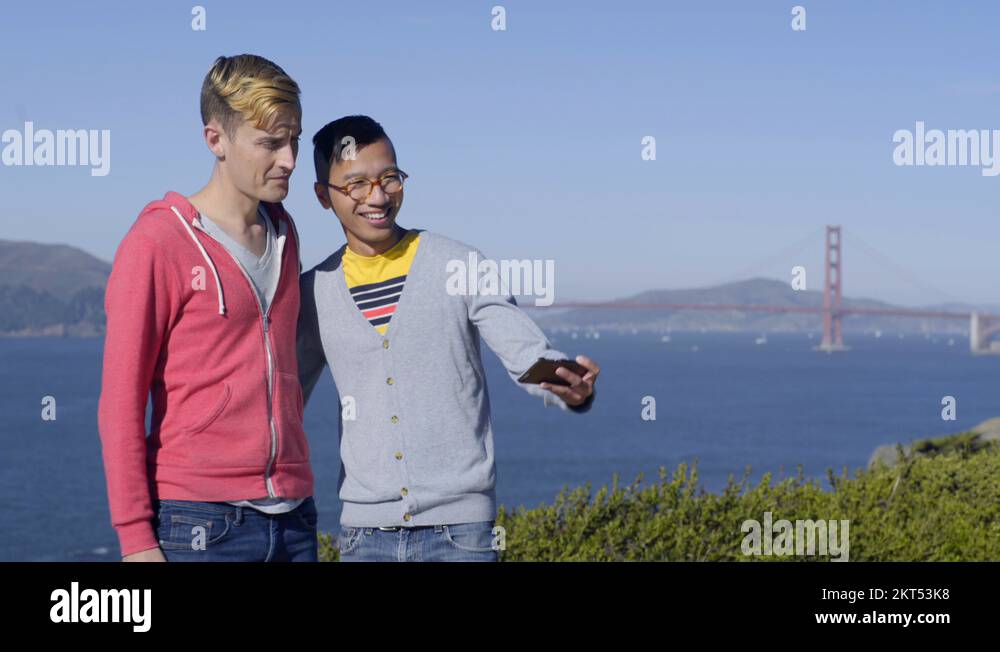 Couple Pose For Selfies, San Francisco Bay And Golden Gate Bridge ...
