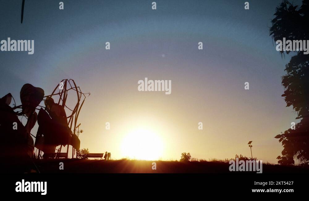 People silhouettes in parc with sun shining behind Stock Video Footage ...