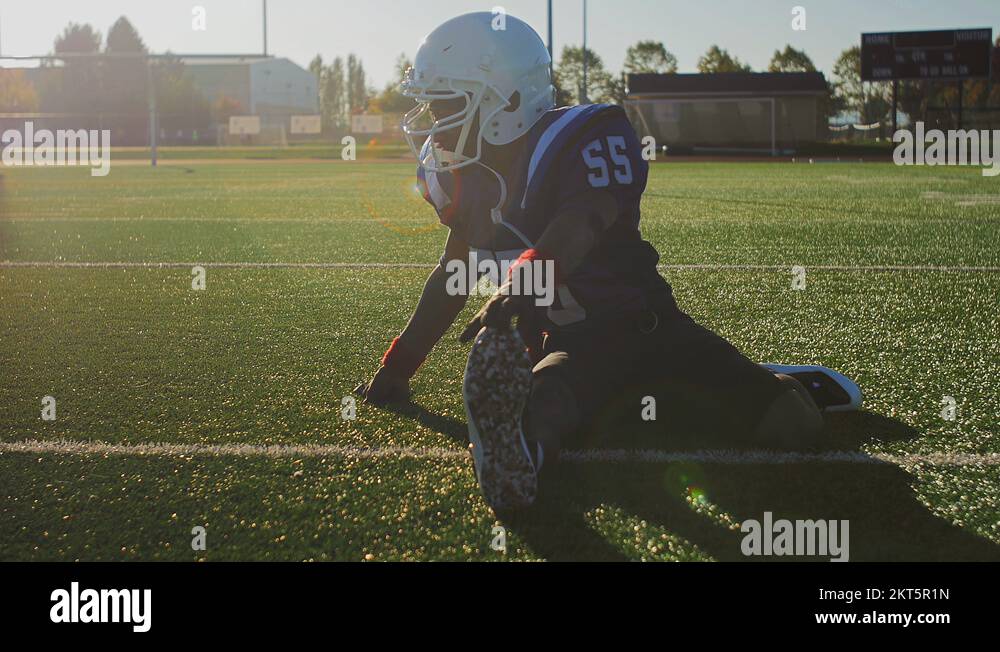 Football players stretching before a game Stock Video Footage - Alamy