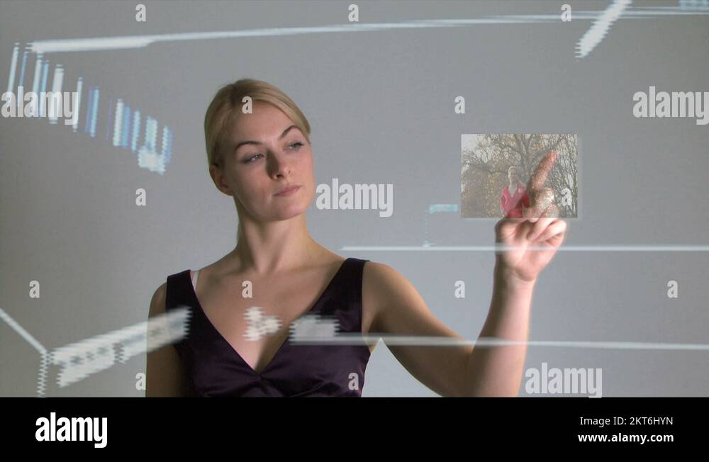 Female touching touch screen wall and scrolling trough life, CGI ...