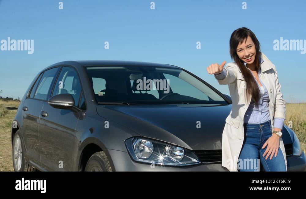 attractive joyful young woman shows thumb up - encourage - smile - eye ...