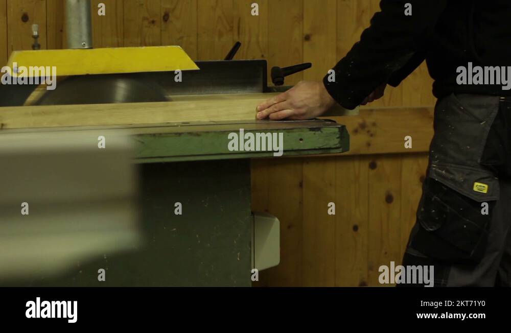 A carpenter using a table saw to cut wood Stock Video Footage - Alamy