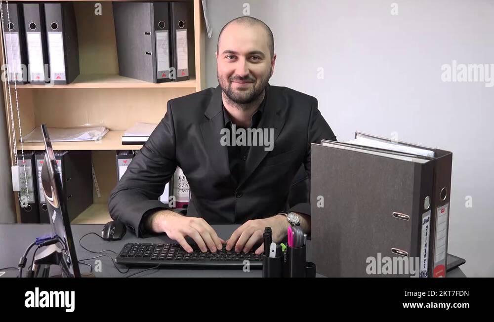 Successful manager at the office smile to camera portrait happy photo ...