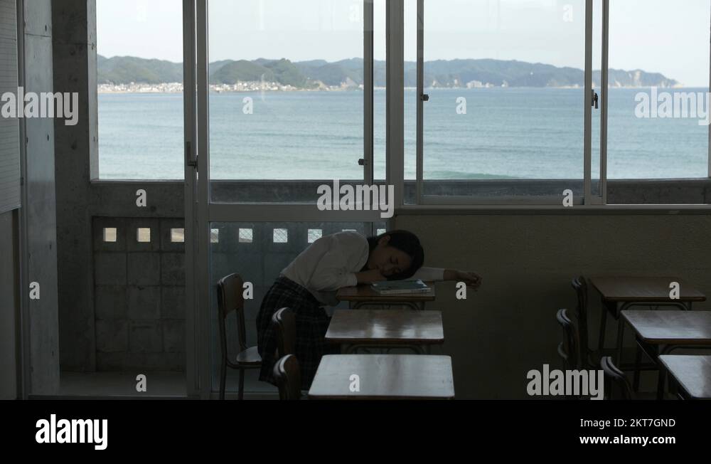 Japanese high-school student sleeping in an empty classroom Stock Video ...