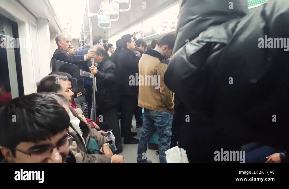 Crowd of people standing inside a fully packed metro train during the ...