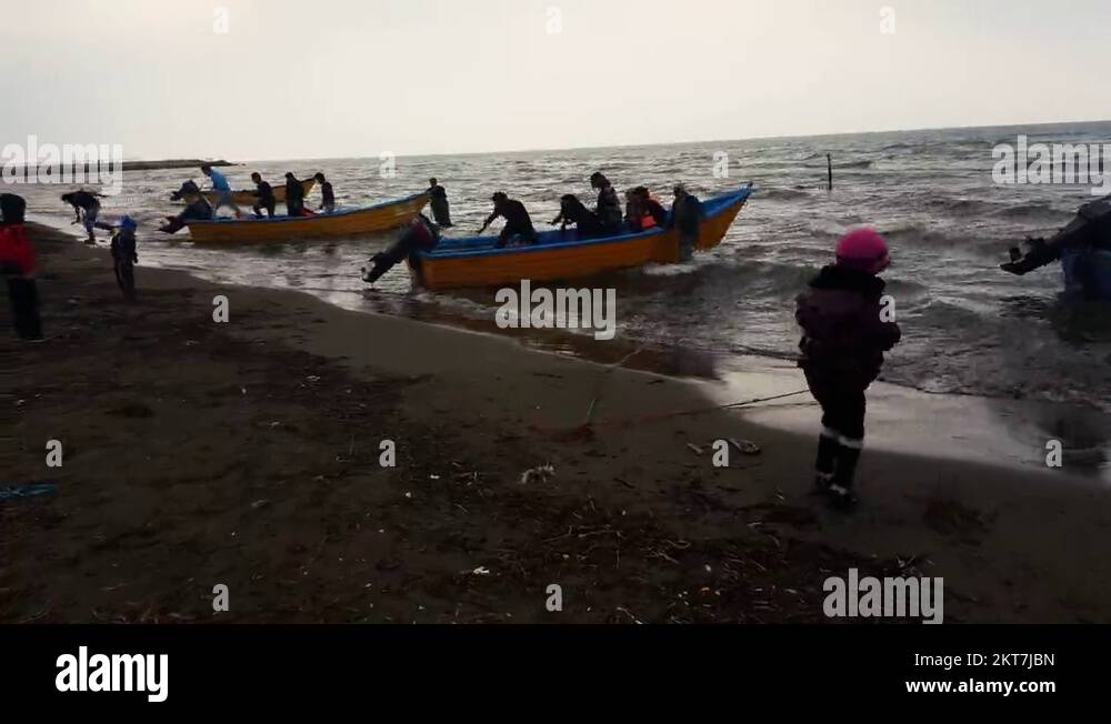 A group of young Iranian boys & girls coming out of a boat in Caspian ...