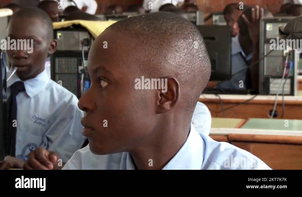 African students laughing out louad at computer lab in school ...