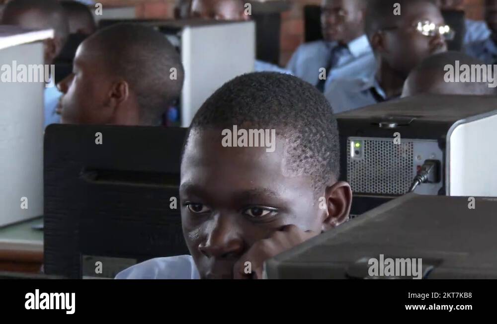 African students studying at computer lab in school - Education in ...