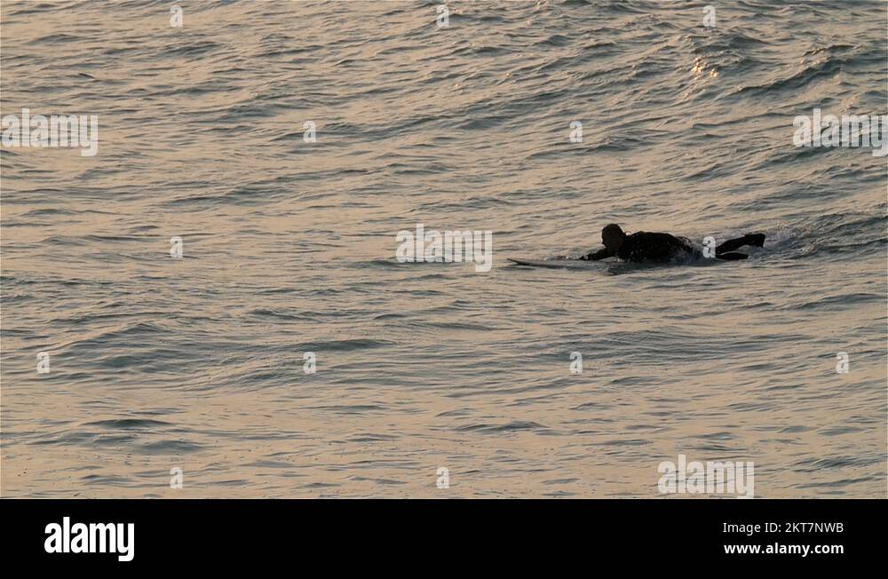 Two surfers surfing on the sea of Etretat Stock Video Footage - Alamy