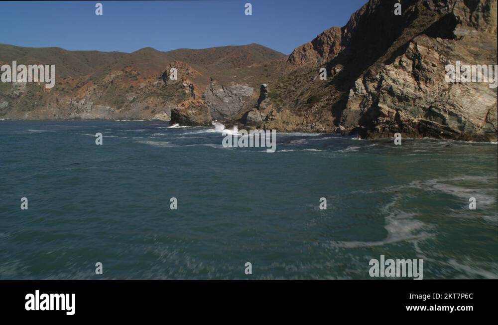 Flying through a gap between a sea stack and the shore on the Catalina ...
