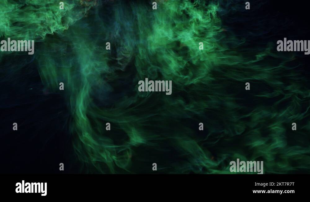 Green flames flowing across the frame, creating a tornado of fire at ...