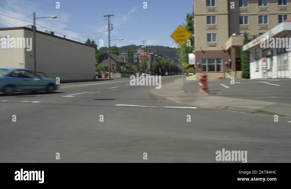 Right Side view of a Driving Plate: Car turns left from NW 23rd Avenue ...