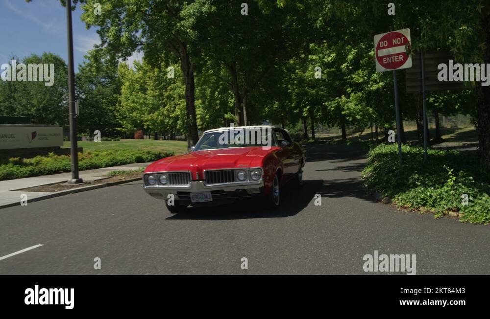 Rear view of a Driving Plate: Car turns left out of Legacy Emanuel ...