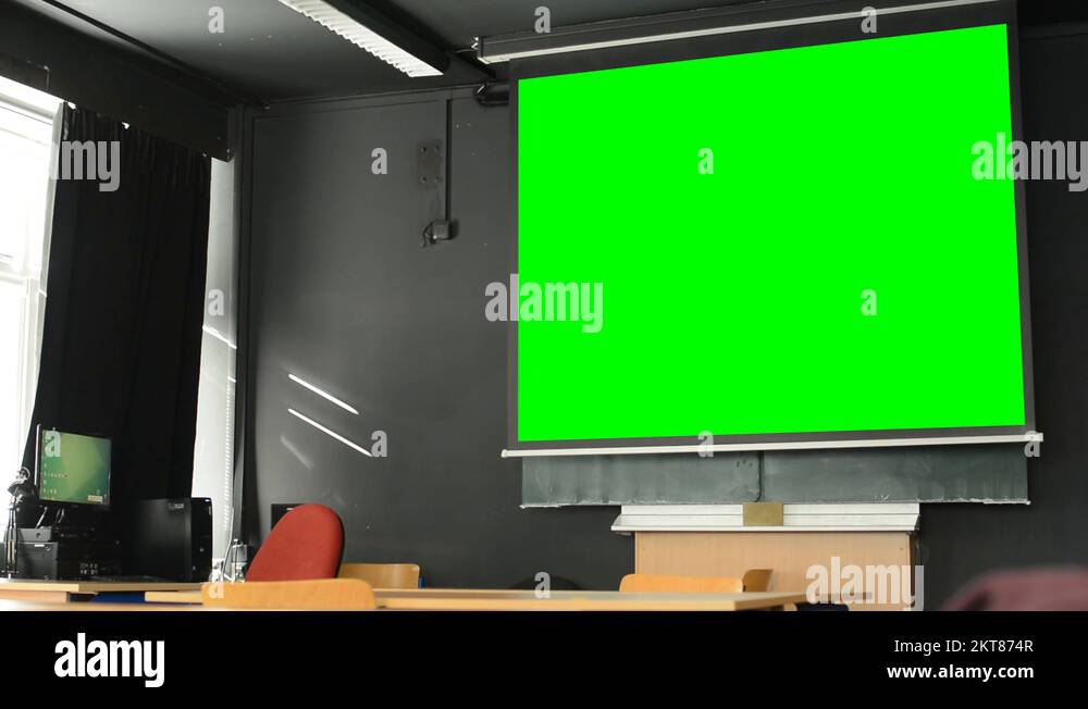 Projection screen with a green background in the classroom for pupils ...