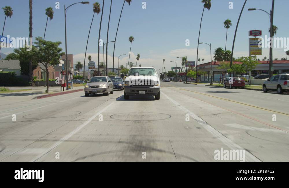 Rear view of a Driving Plate: Car travels east on Colorado Boulevard in ...