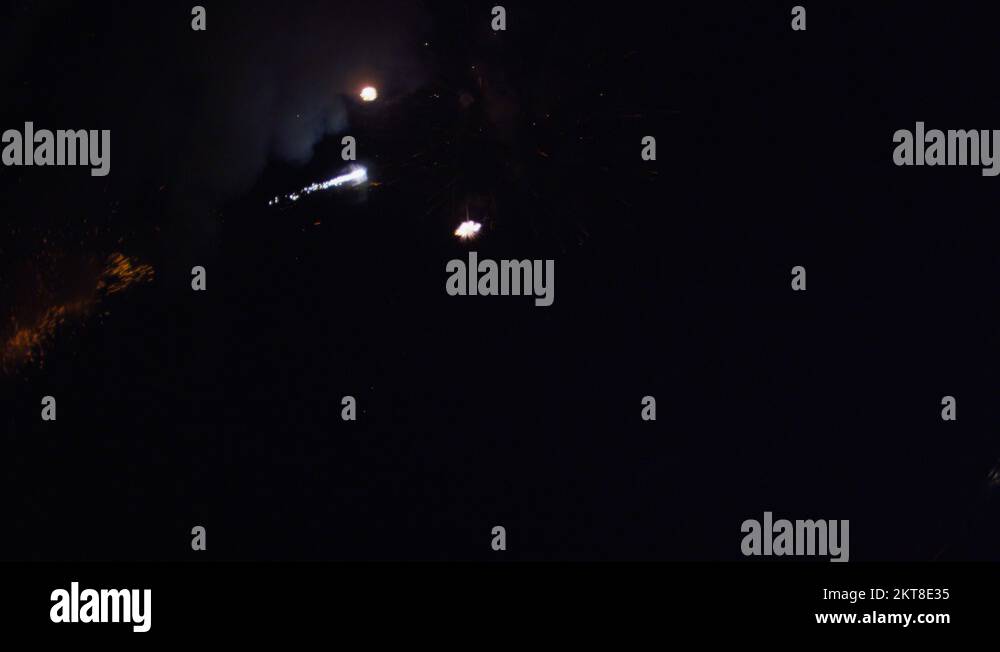 Fireworks rockets fly in from left and right of frame and burst Stock ...