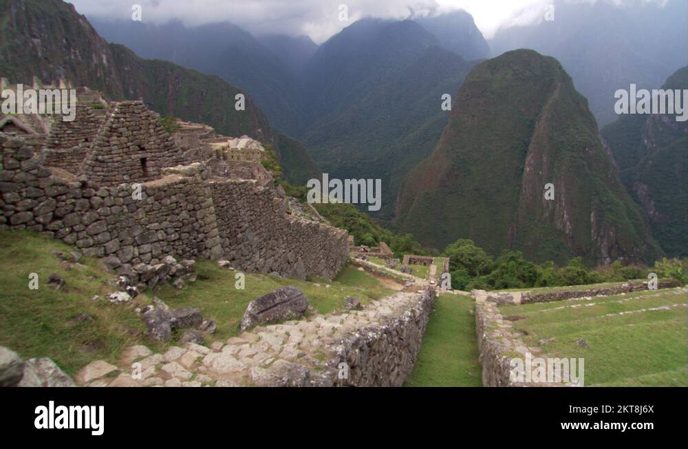 Machu Picchu, Peru:Stone walls with peak of Huayna Picchu in mid-frame ...