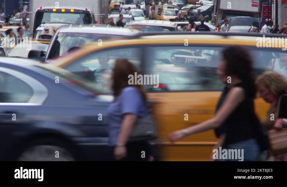 Times Square standstill traffic with pedestrians crossing street Stock ...