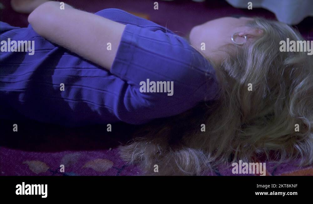 Teenage girl lying on bedroom rug near overturned pill container Stock ...