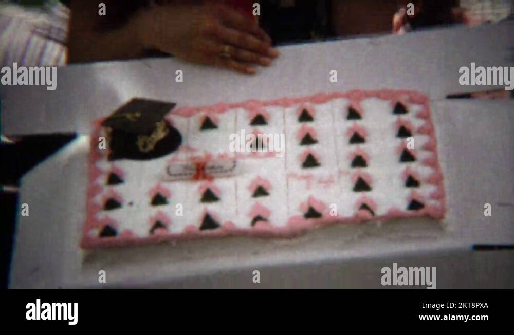 1973: High school graduation cake held by celebrated student Stock ...