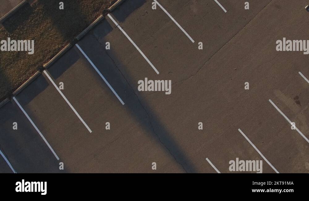 Rotating above empty parking spots in lot aerial view 4k Stock Video ...
