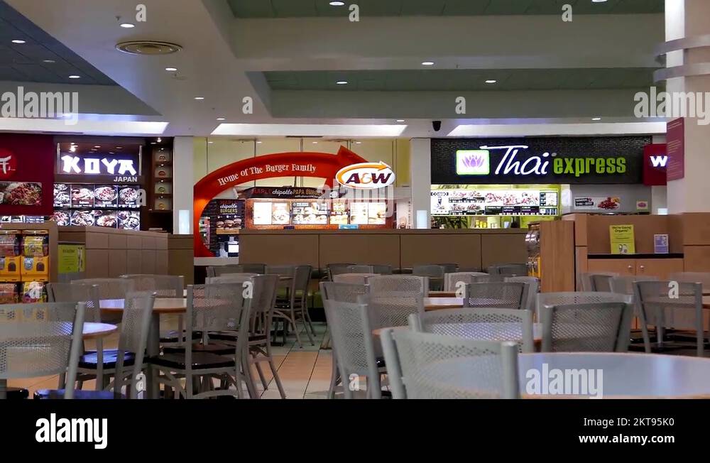 One side of people eating food at food court area inside shopping mall ...