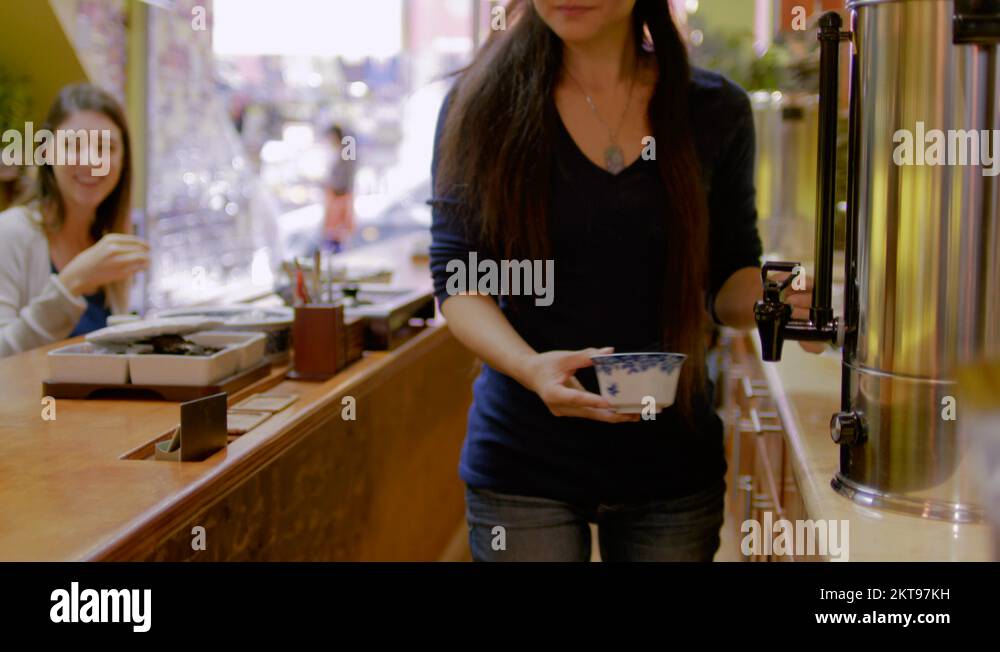 Woman serving tea Stock Videos & Footage - HD and 4K Video Clips - Alamy