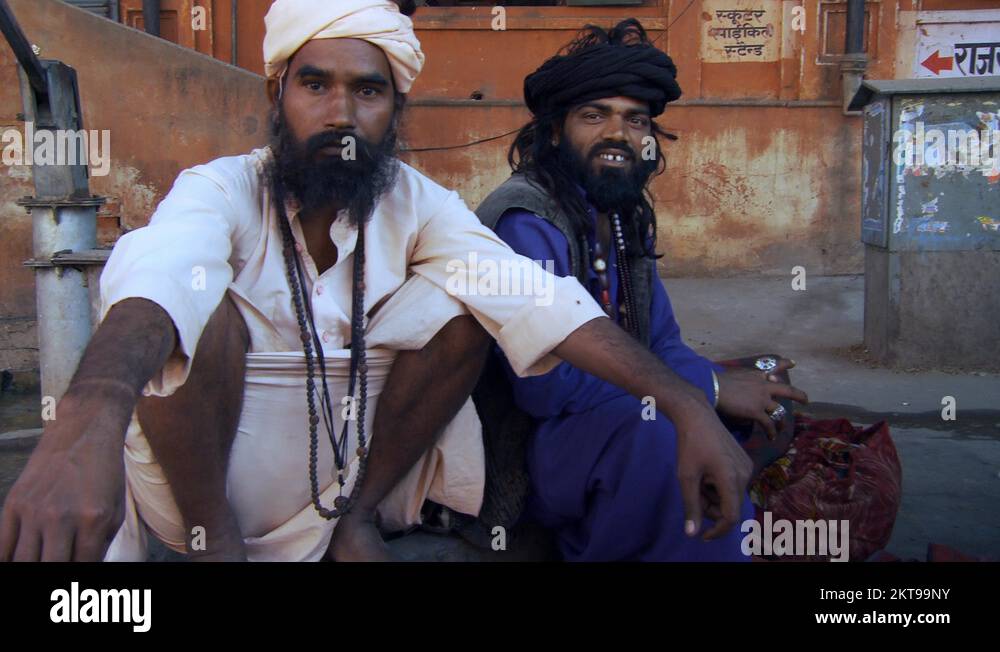 two indian men squatting in traditional india clothes Stock Video ...