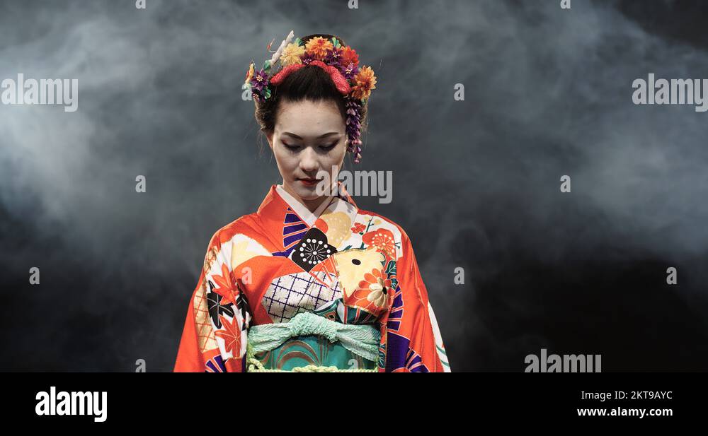4K beautiful Japanese geisha dancing on stage and posing for the camera ...