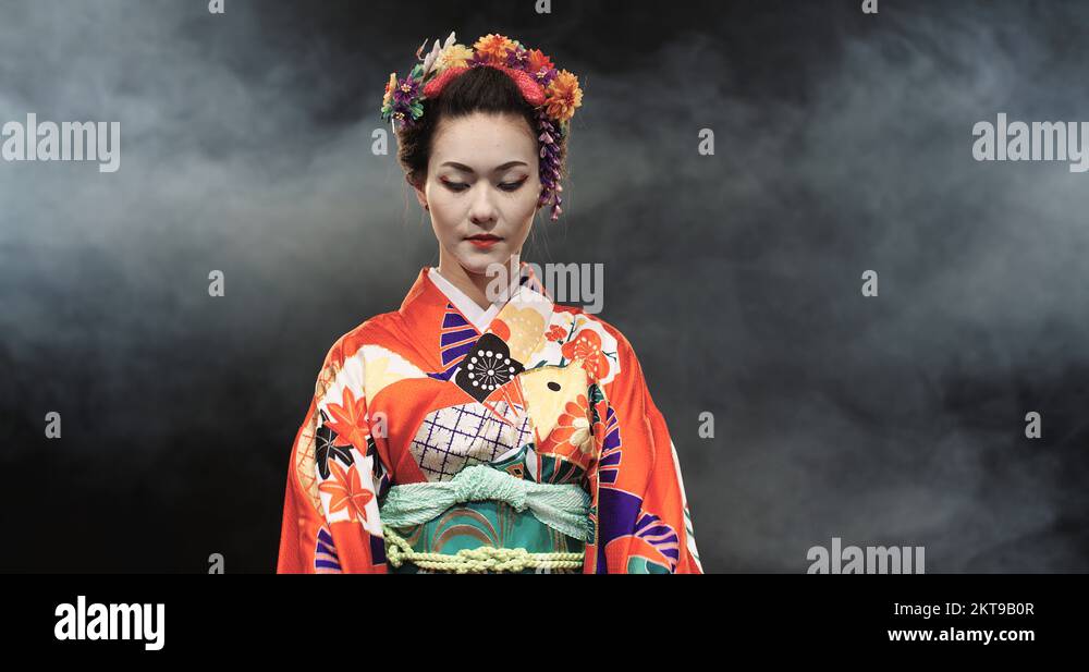 4K beautiful Japanese geisha dancing on stage and posing for the camera ...