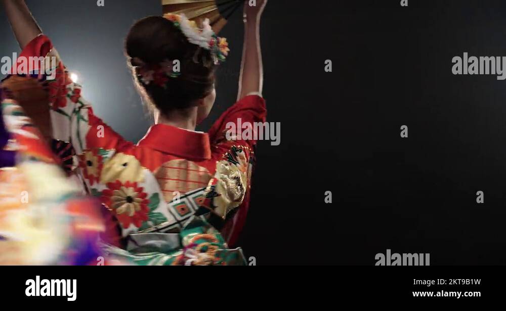 4K beautiful Japanese geisha dancing on stage and posing for the camera ...