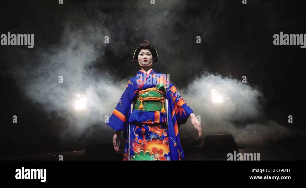 4K beautiful Japanese geisha dancing on stage and posing for the camera ...