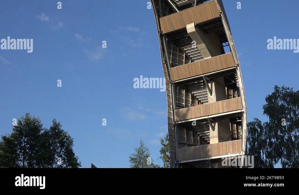 Tourist people visit unusual observation place tower in nature. Tilt up ...