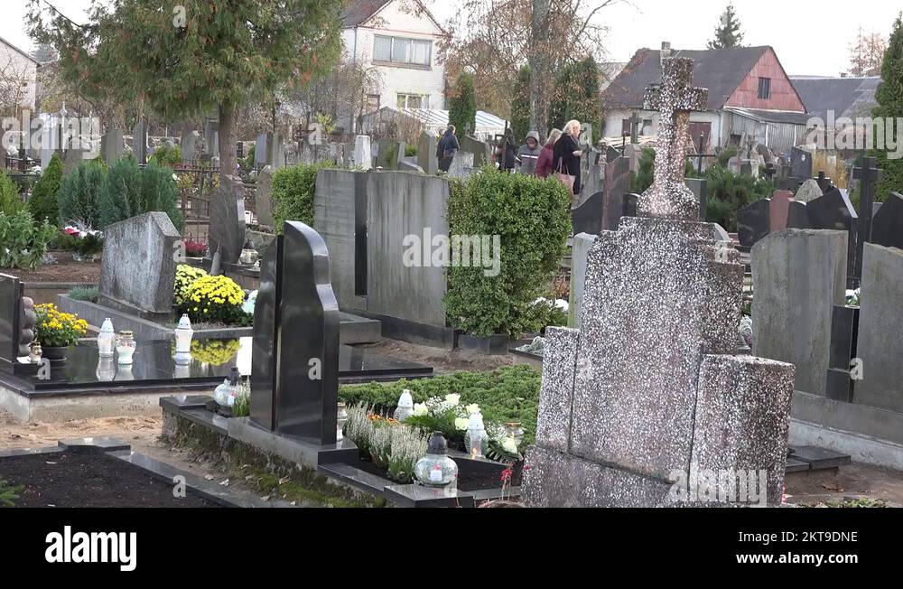 People visit graves in graveyard in the day of all dead. 4K Stock Video ...