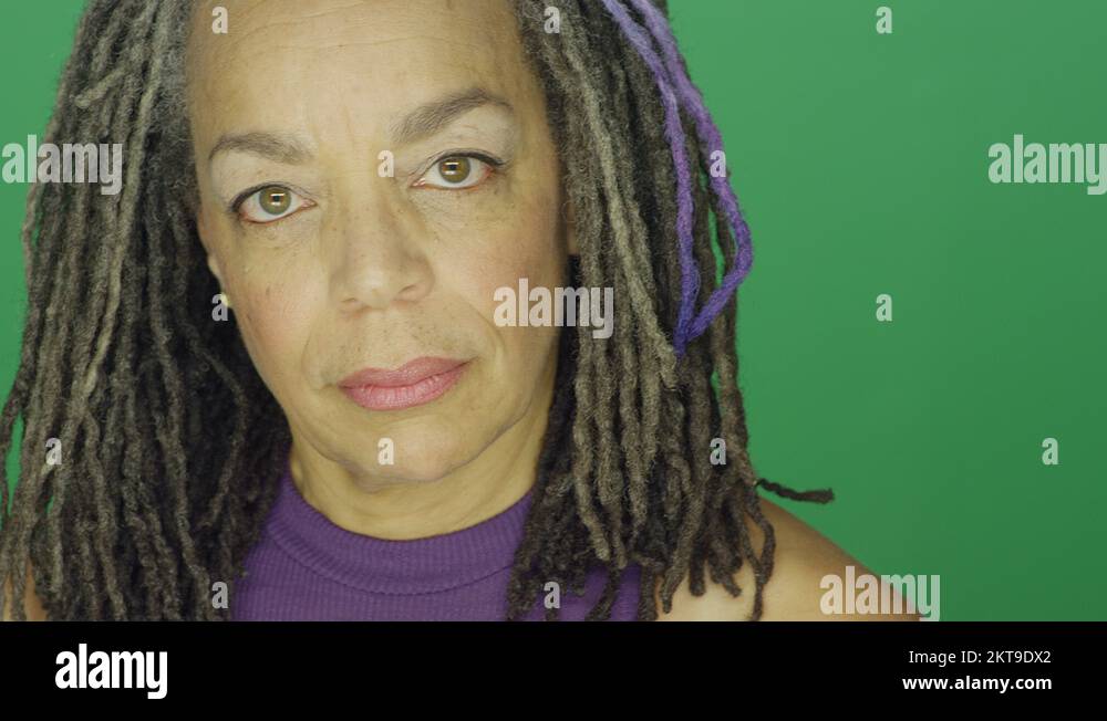African American Woman Stares On A Green Screen Background Stock Video