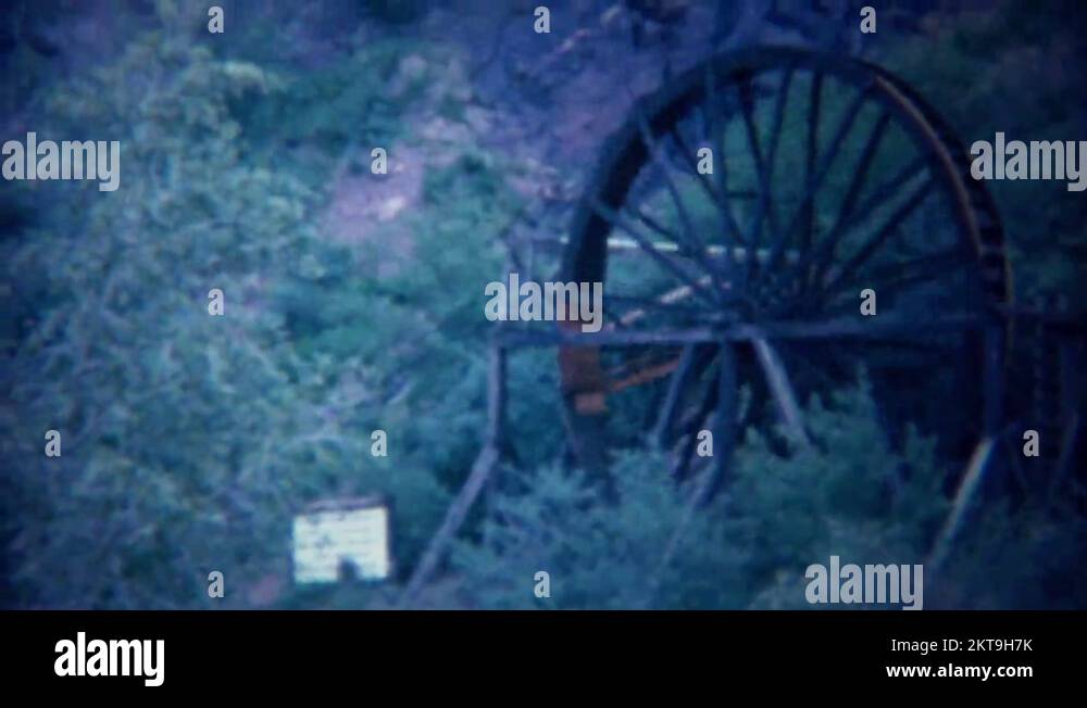 1940: Waterfall powered water wheel turning to create work Stock Video ...