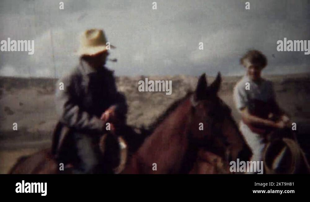 1940: Pipe smoking cowboy and wife riding horses on the range Stock ...